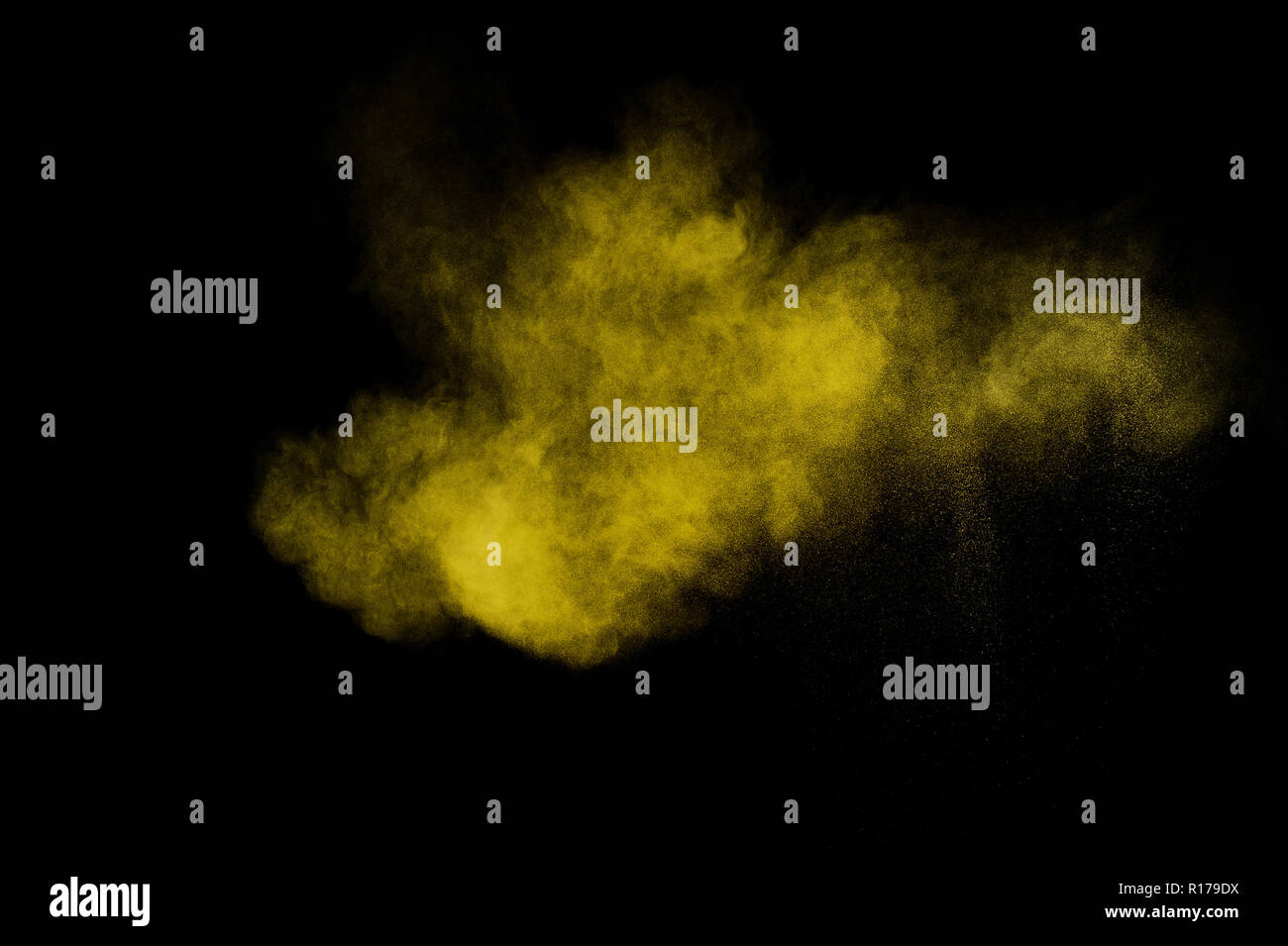 Yellow powder explosion on black background. Colored powder cloud ...