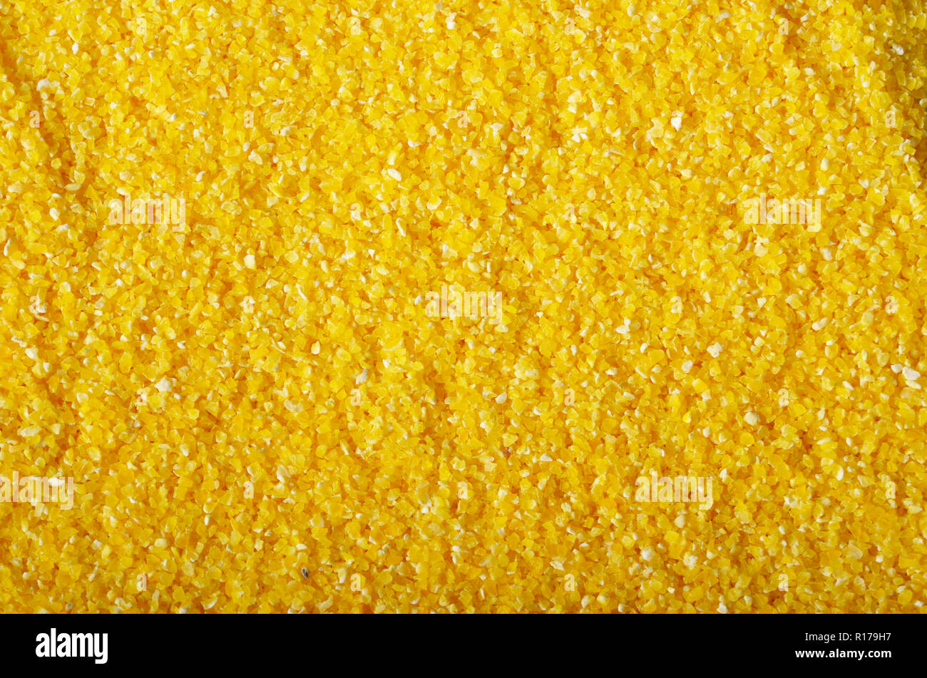Corn grits texture background view from top point Stock Photo - Alamy