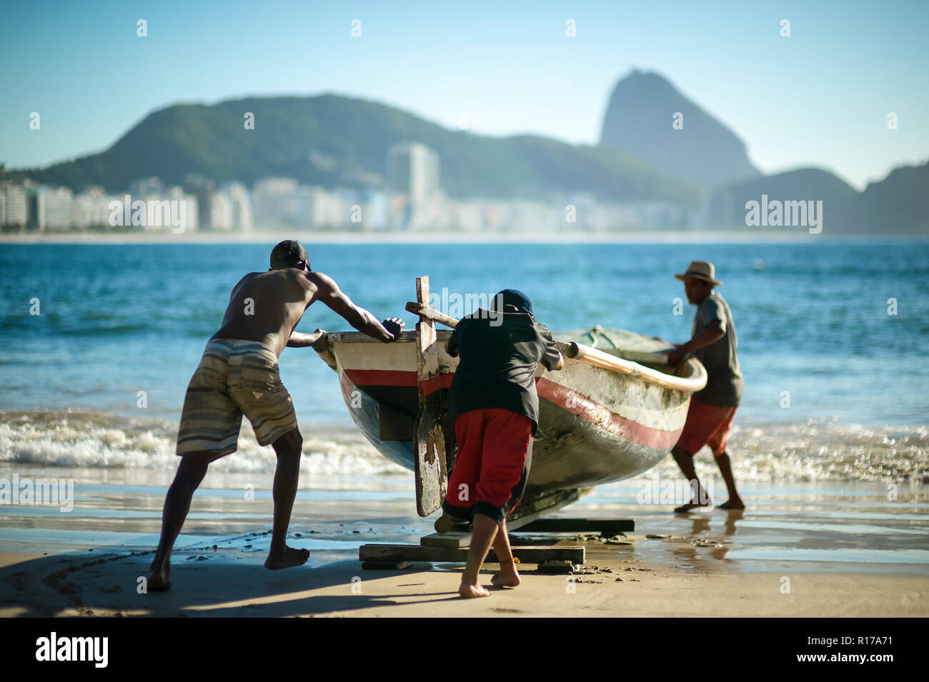 RIO DE JANEIRO - CIRCA FEBRUARY, 2018: A group of Brazilian men work ...