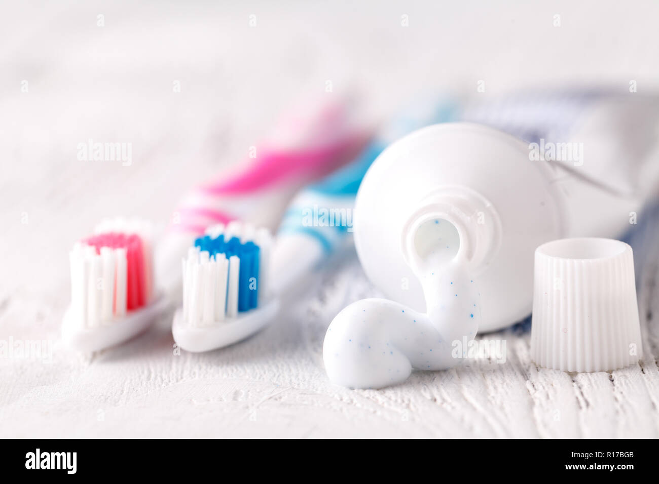 Color toothbrush with the color toothpaste Stock Photo - Alamy