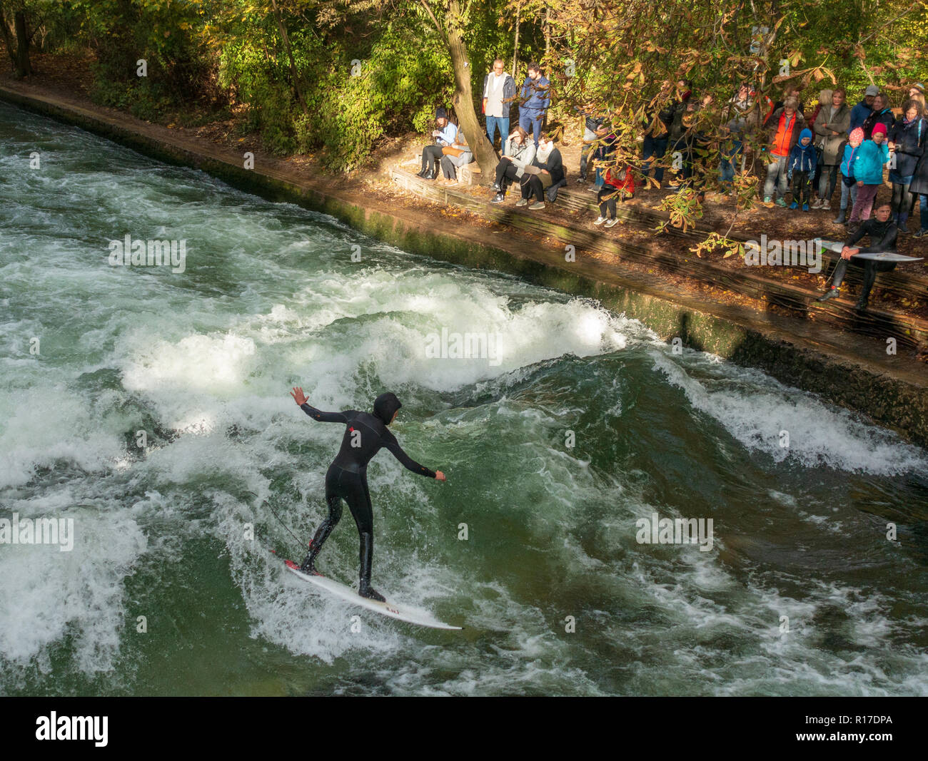 River surfing on the Eisbach river in Munich Stock Photo - Alamy