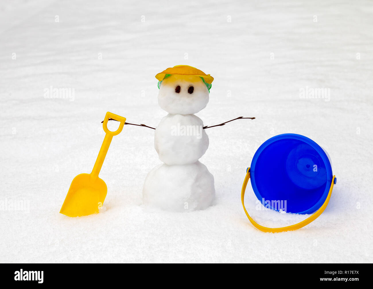 A snowman wishing he was at the beach with his bucket pail and shovel ...
