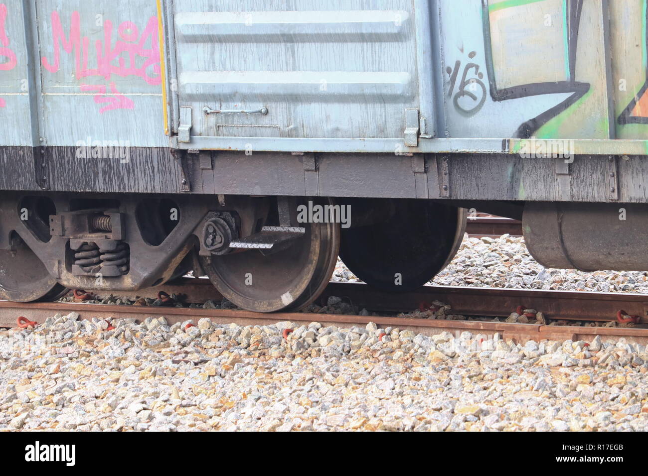 closeup wheel of a train on railroad at the station Stock Photo - Alamy