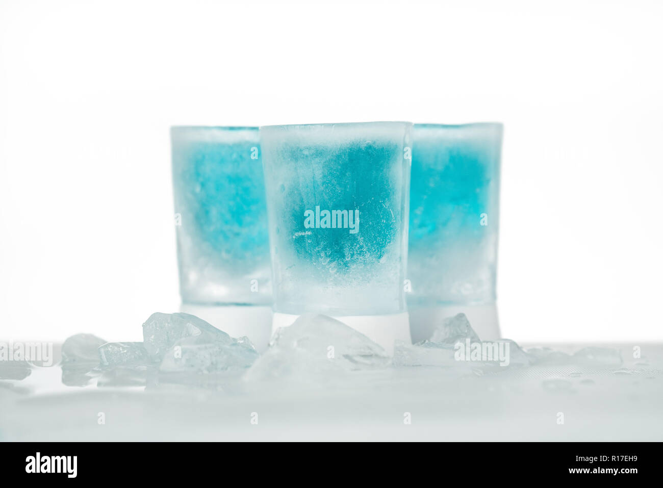 Three Ice Shots with blue alcohol Stock Photo - Alamy