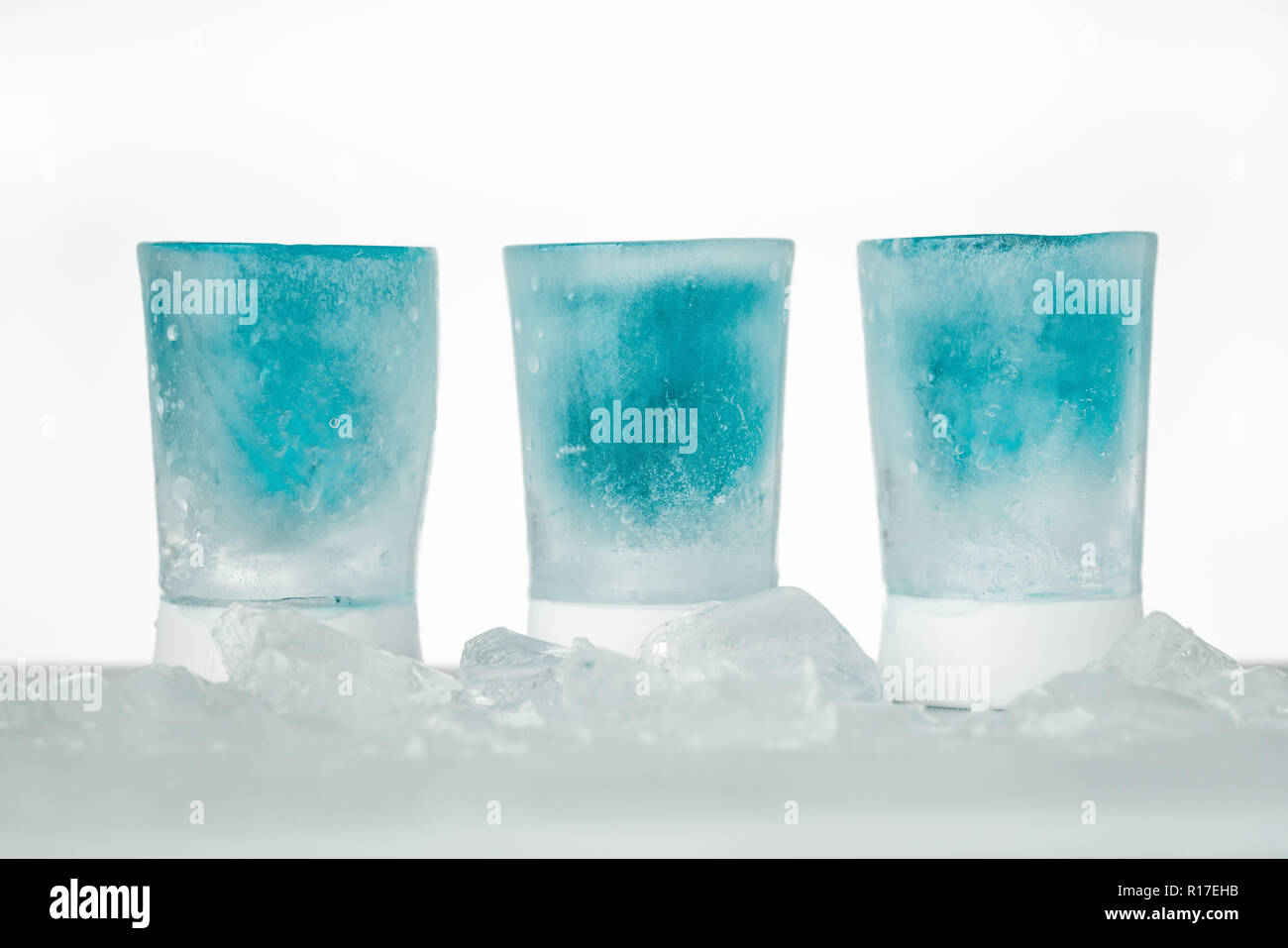 Three Ice Shots with blue alcohol Stock Photo - Alamy