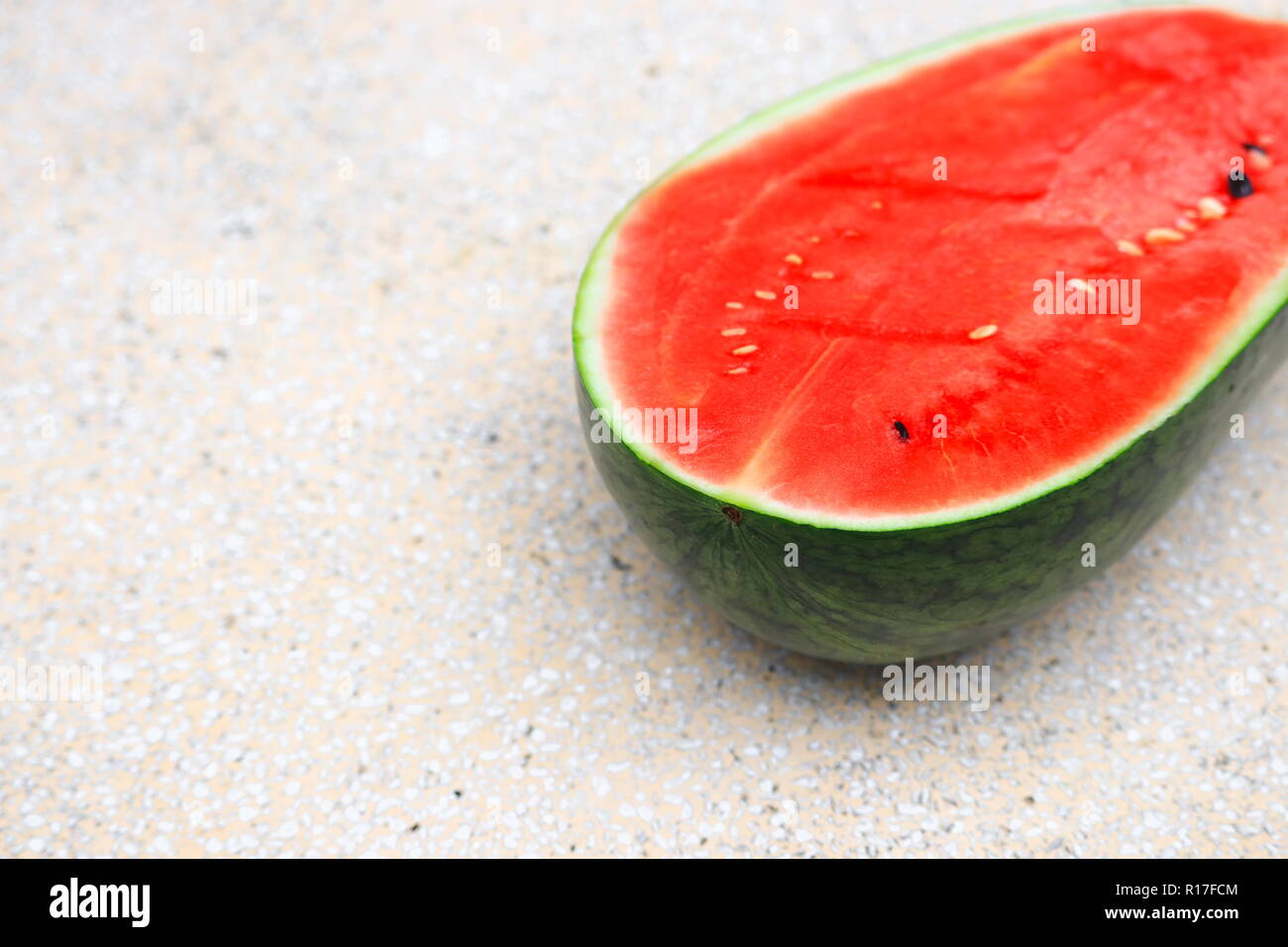 watermelon red fresh half on polished stone table select focus with ...