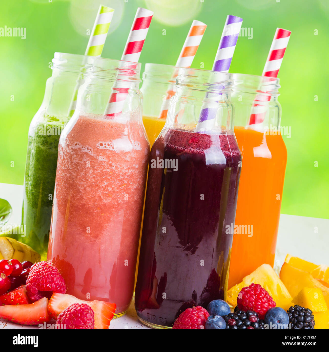Selection of colourful smoothies on rustic wood background Stock Photo ...