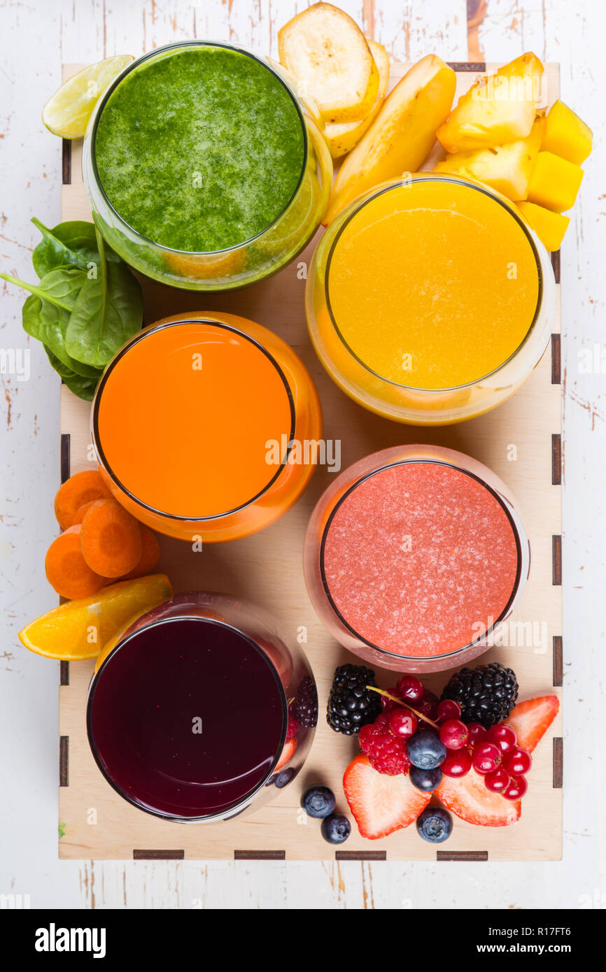 Selection of colourful smoothies on rustic wood background Stock Photo ...