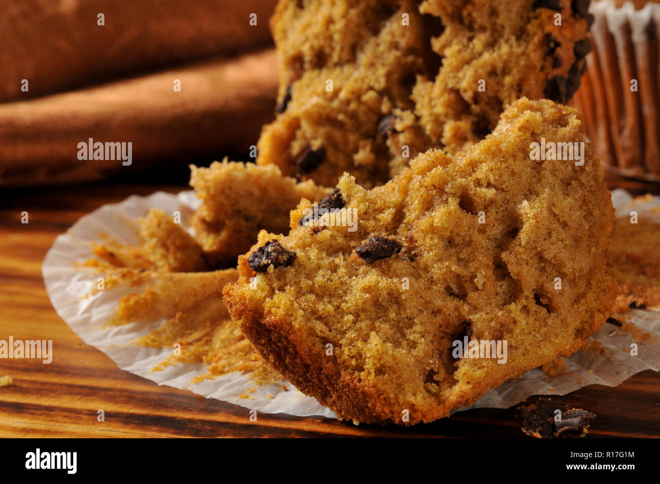 A broken piece of a chocolate chip muffin Stock Photo - Alamy