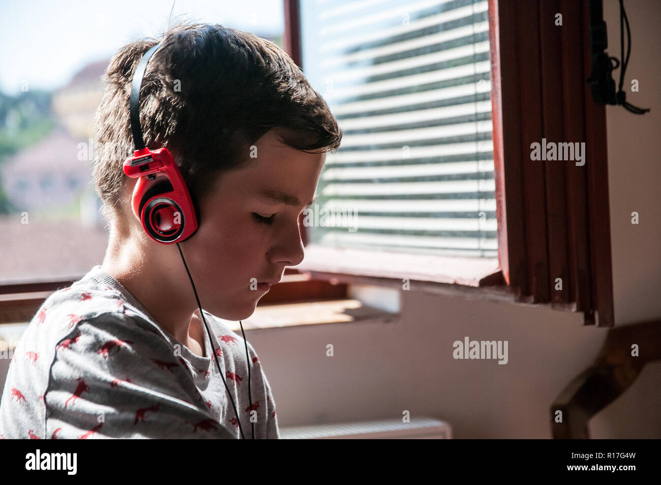 Open window boy teenager hi-res stock photography and images - Alamy