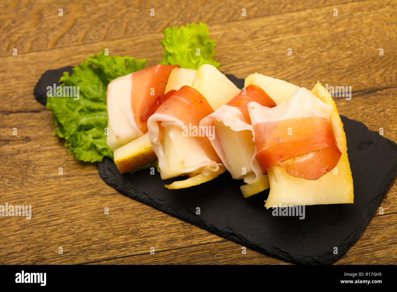 Spanish Hamon with melon Stock Photo - Alamy