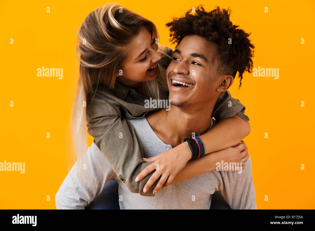 Image Of Happy Cute Young Loving Couple Posing Isolated Over Yellow