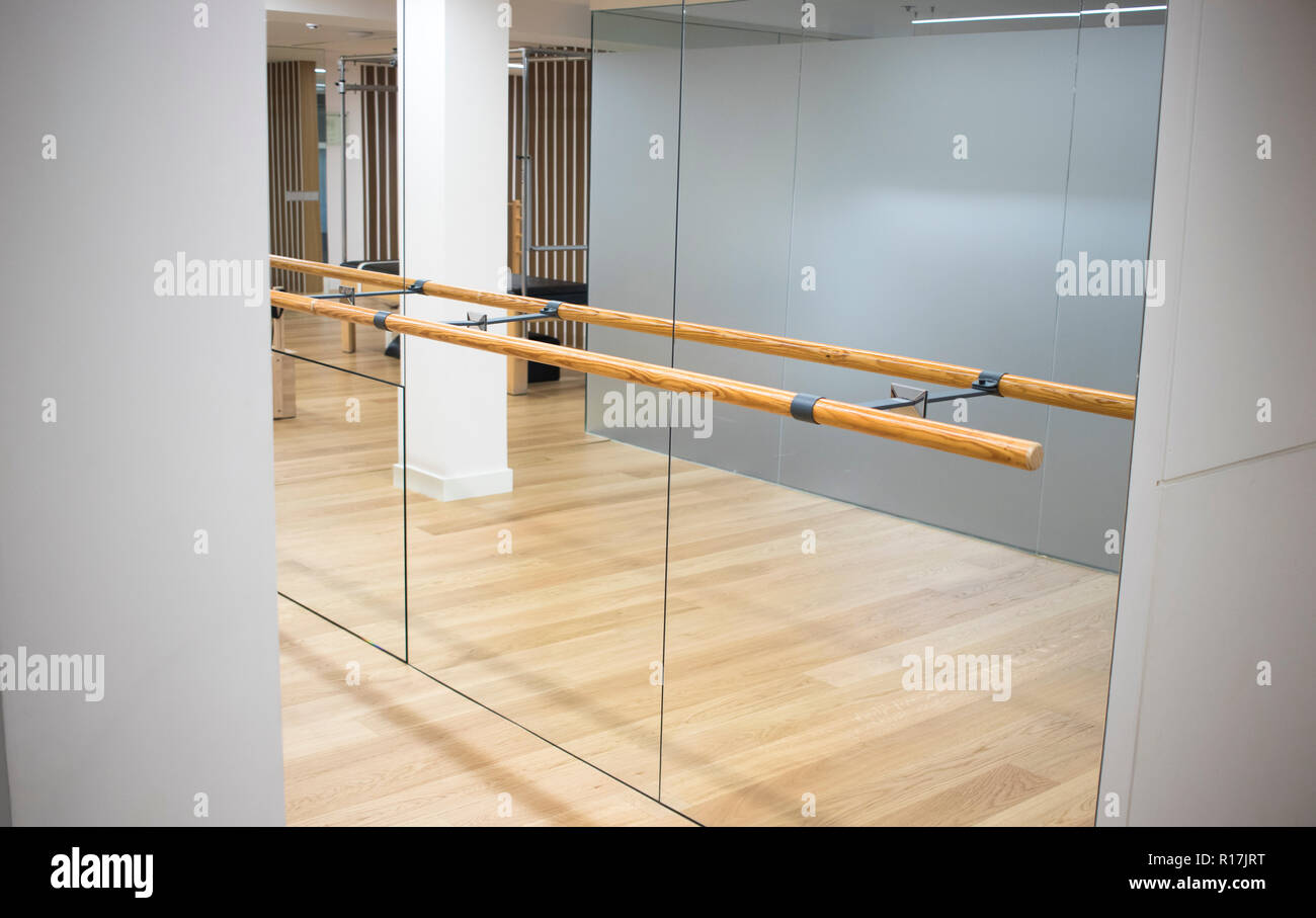 Pilates fitness studio gym room with training dance ballet bar for ...