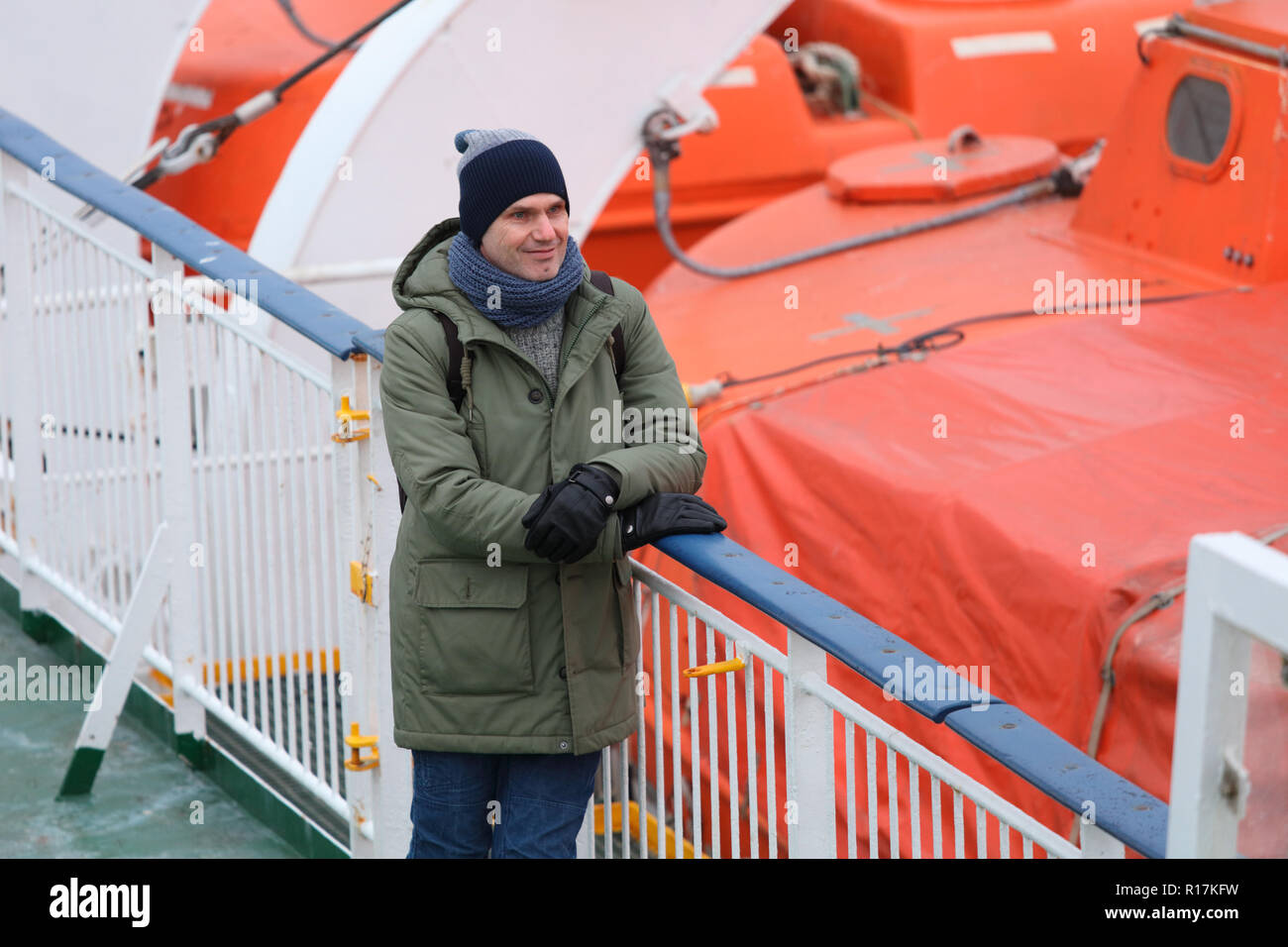 Man on a deck of cruise liner during winter cruise Stock Photo - Alamy
