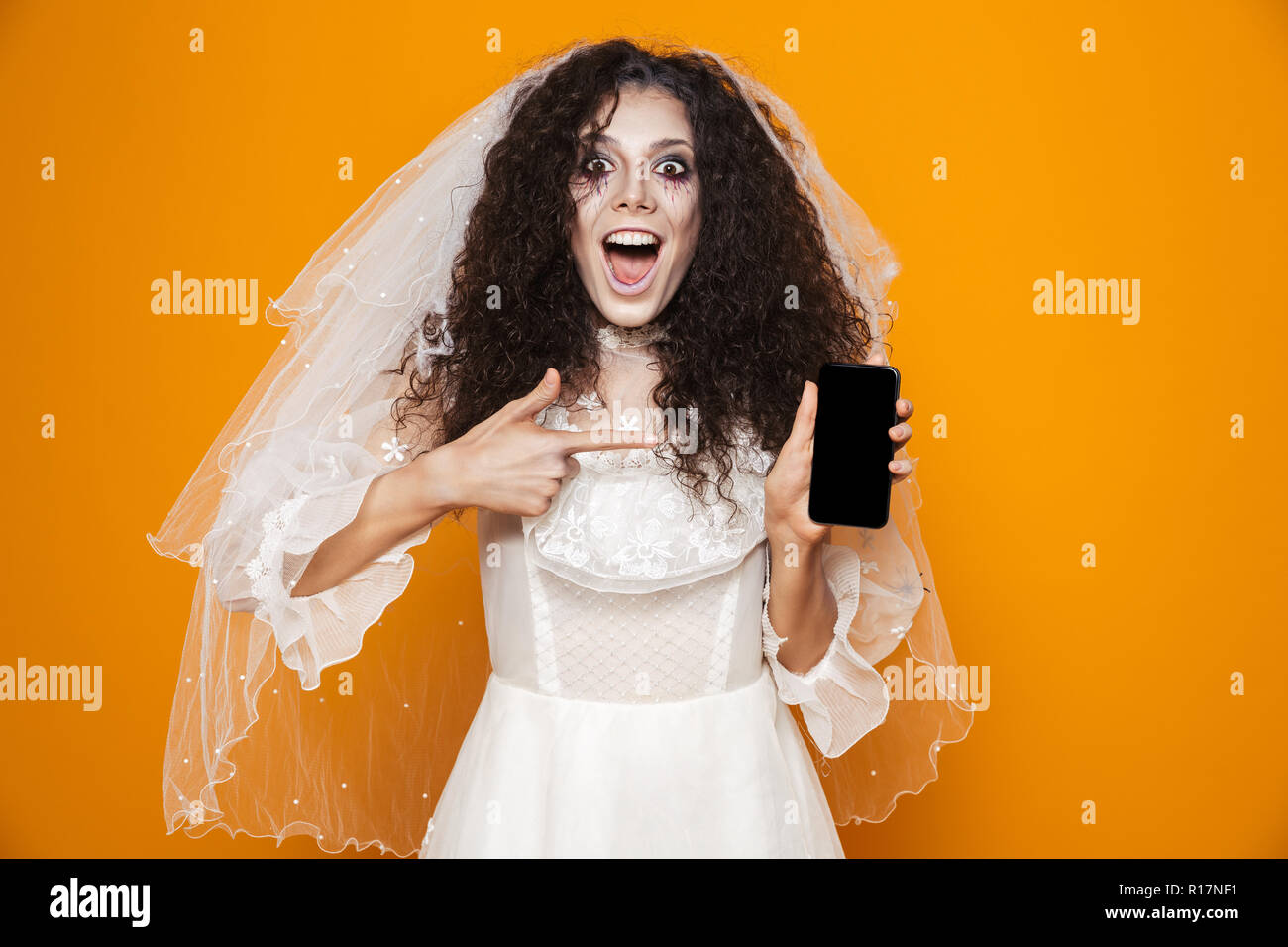 Image of excited zombie woman on halloween wearing wedding dress and ...