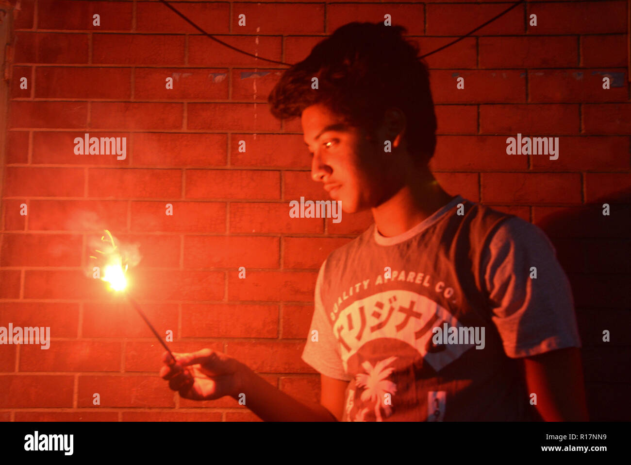 Hindu devotees light up oil lamp and candle to celebrate Diwali, the ...
