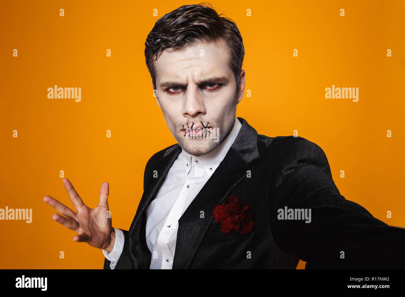 Creepy man in suit hi-res stock photography and images - Alamy