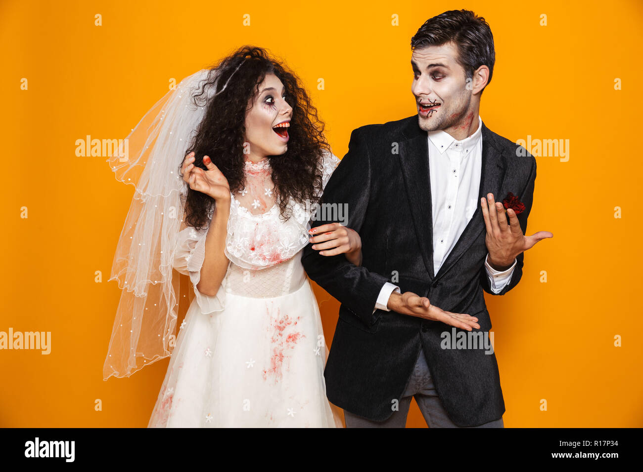 Photo of happy zombie couple bridegroom and bride wearing wedding ...