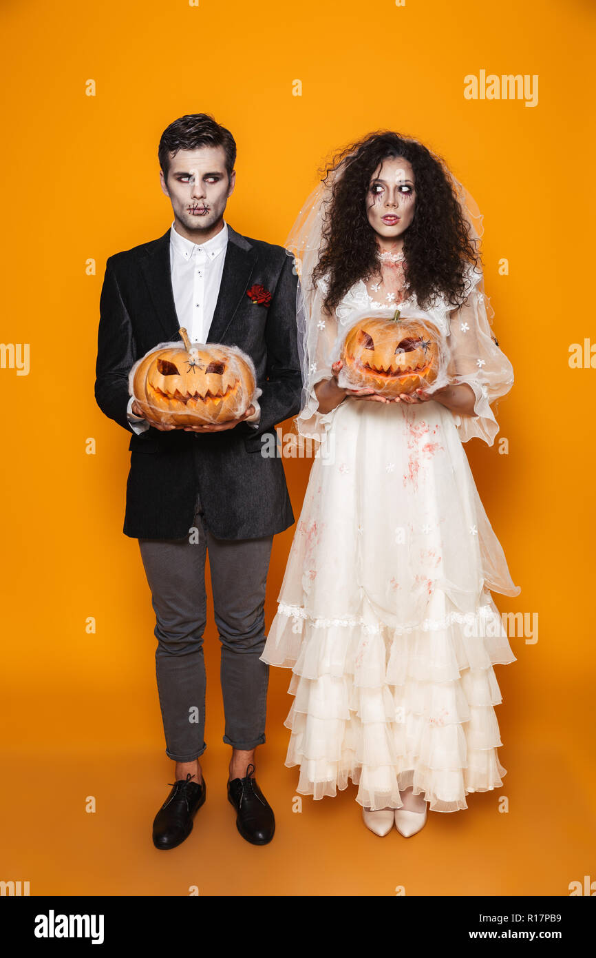 Full length photo of beautiful zombie couple bridegroom and bride ...