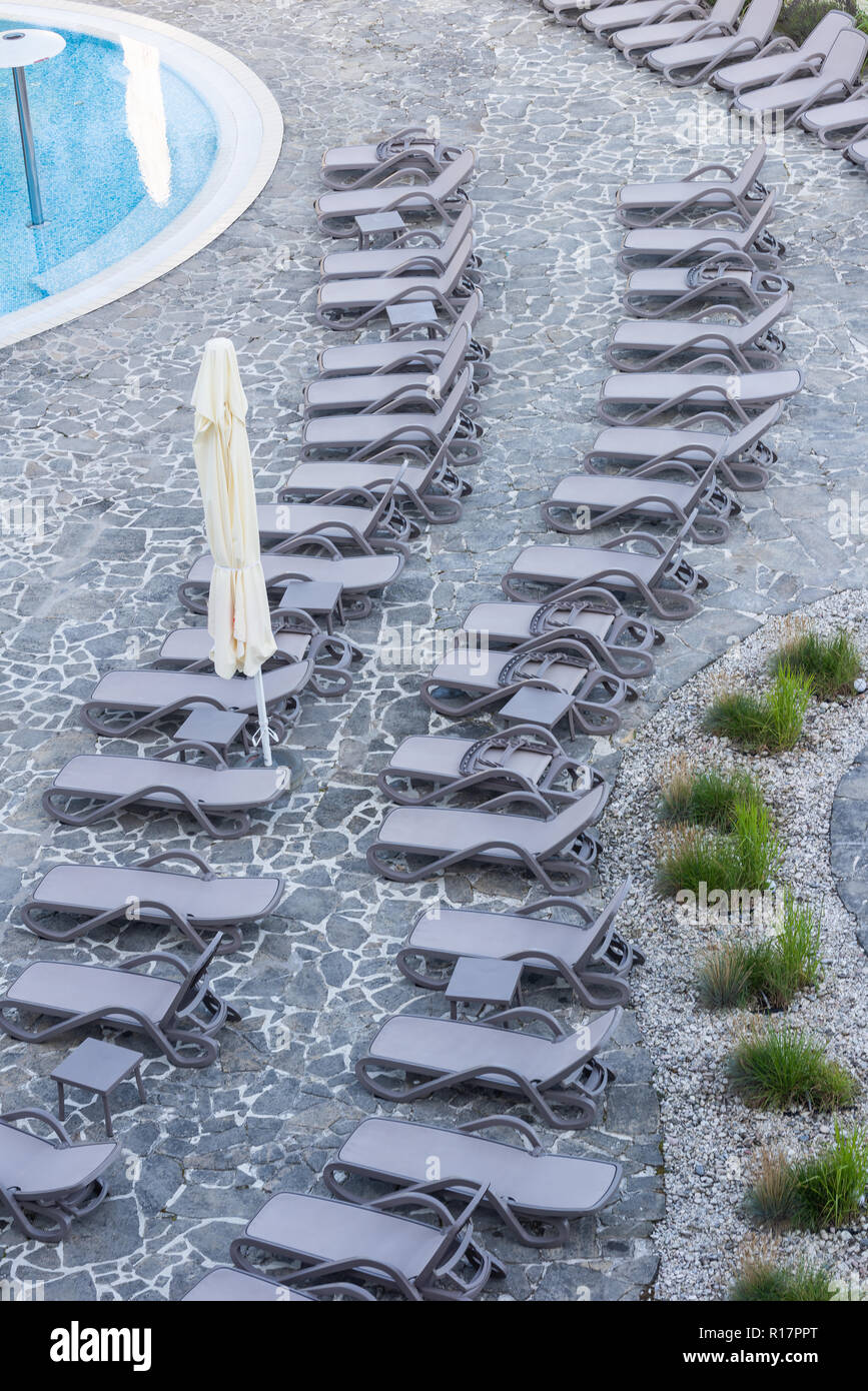 sun loungers by the pool. No people Stock Photo - Alamy