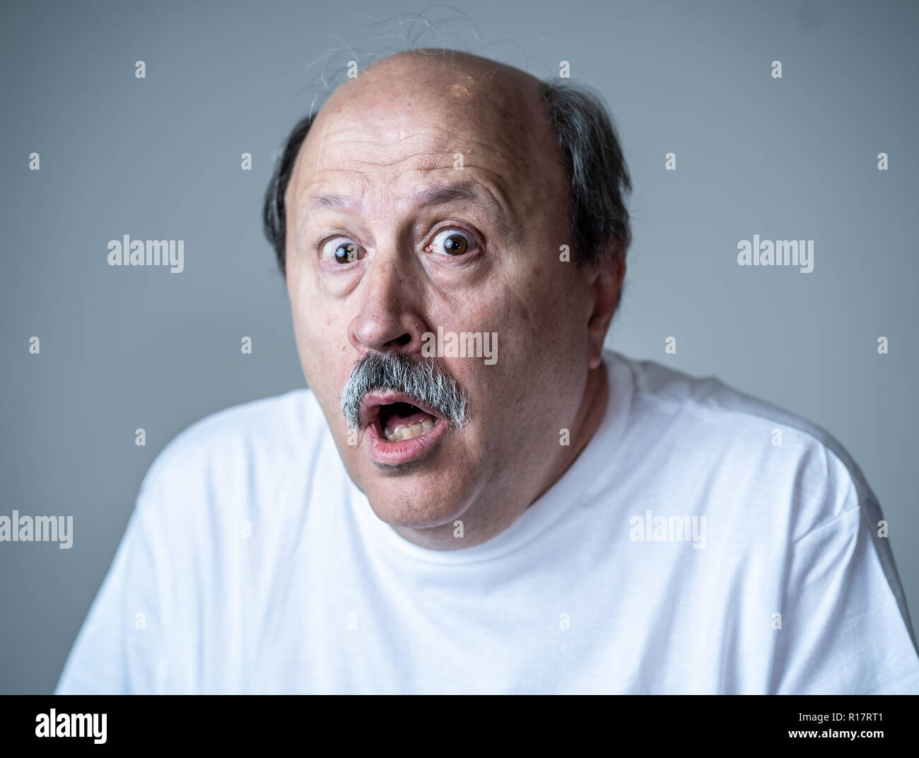 Close up portrait of a scared frightened old man in expression of fear ...