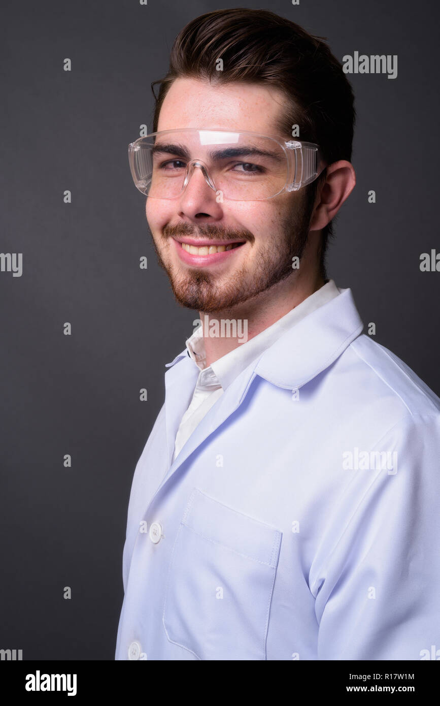 Portrait of smiling young man wearing glasses hi-res stock photography ...