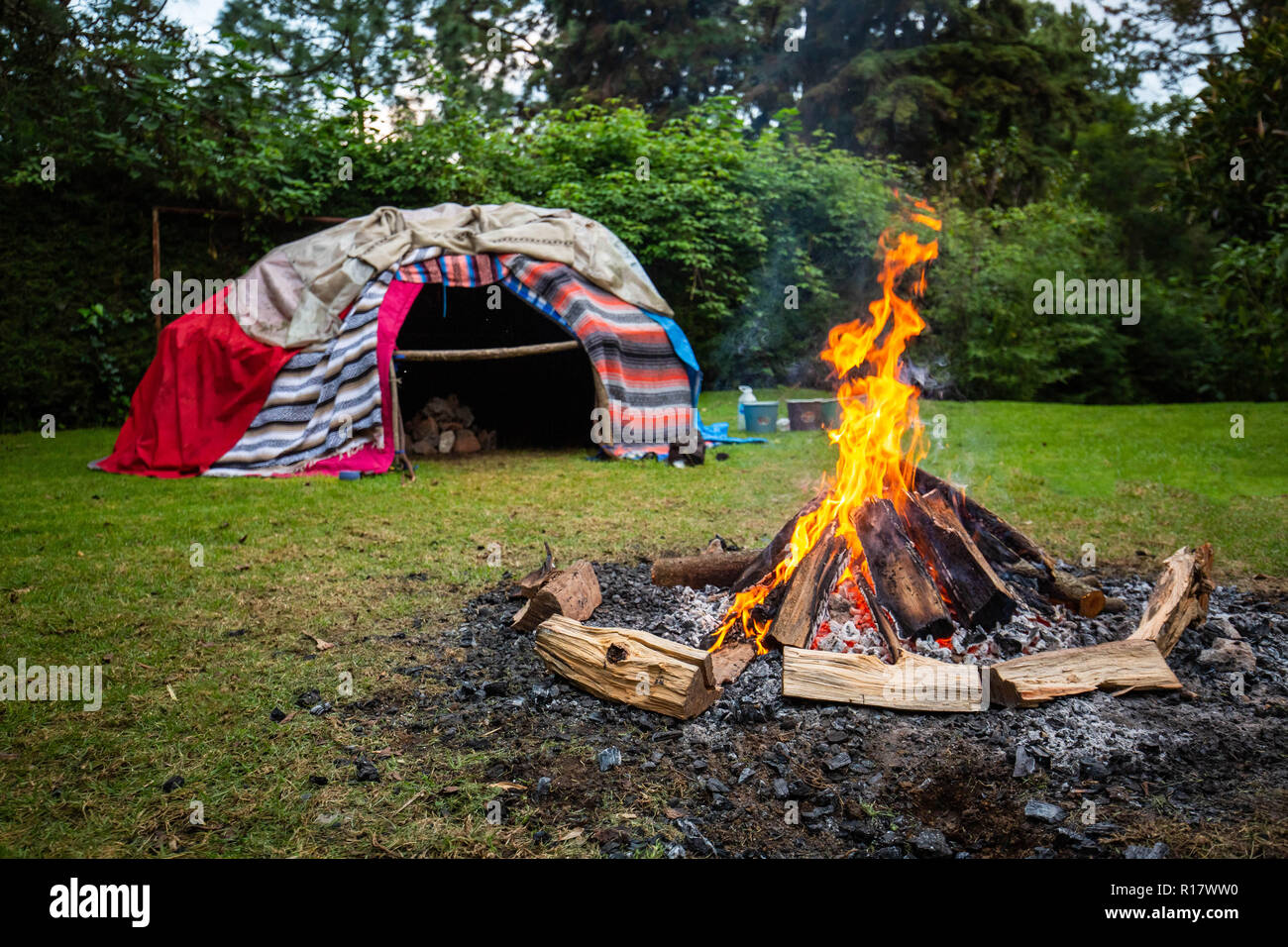 Traditional native sweat lodge with hot stones inside Stock Photo - Alamy