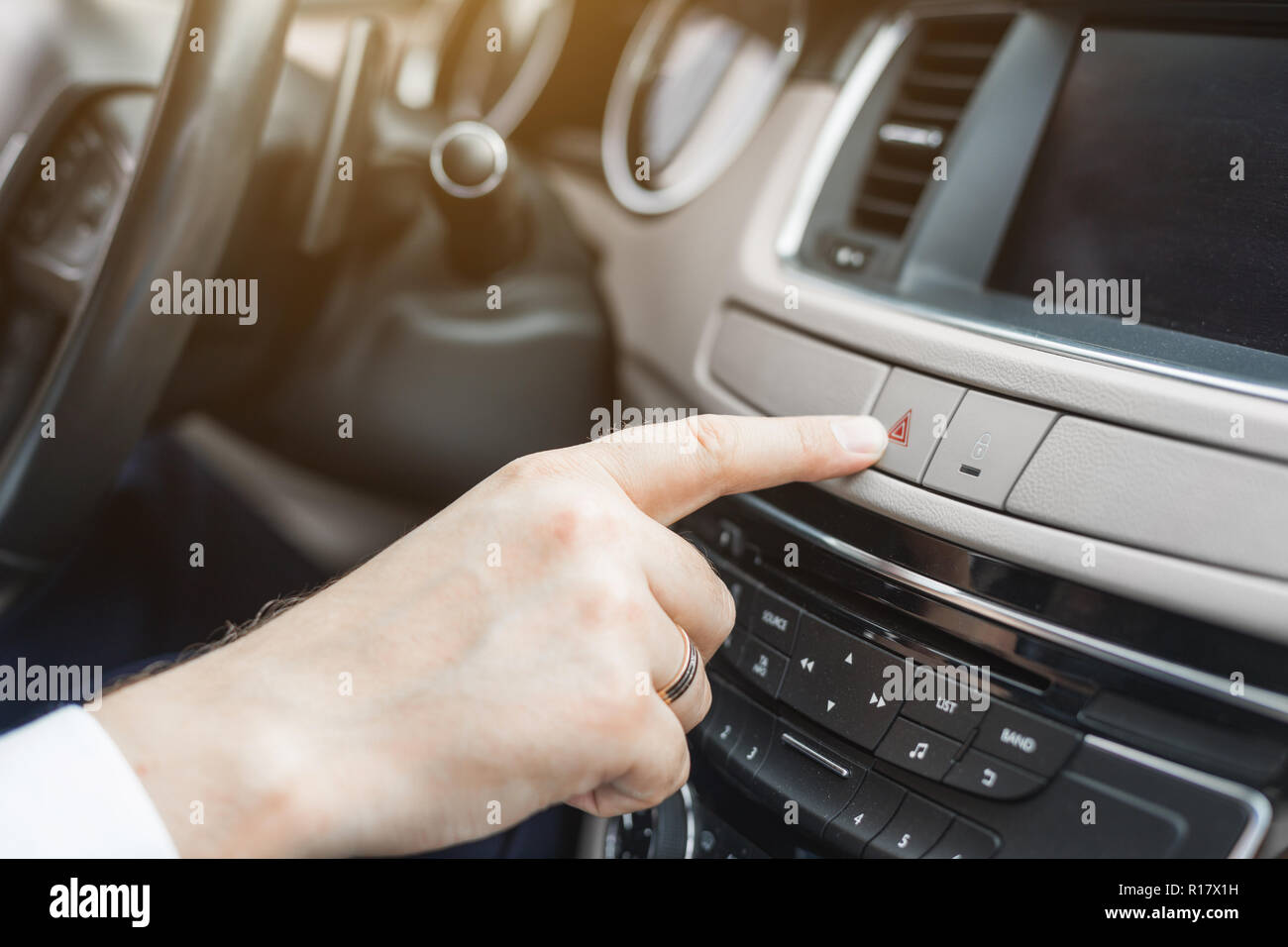 presses the emergency stop button in the car Stock Photo - Alamy