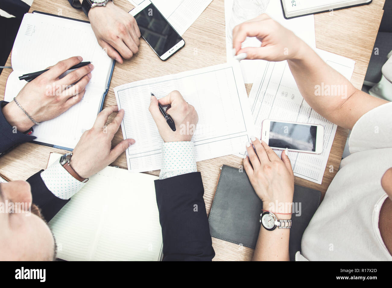 Group of business meeting at the table in the modern office of an ...