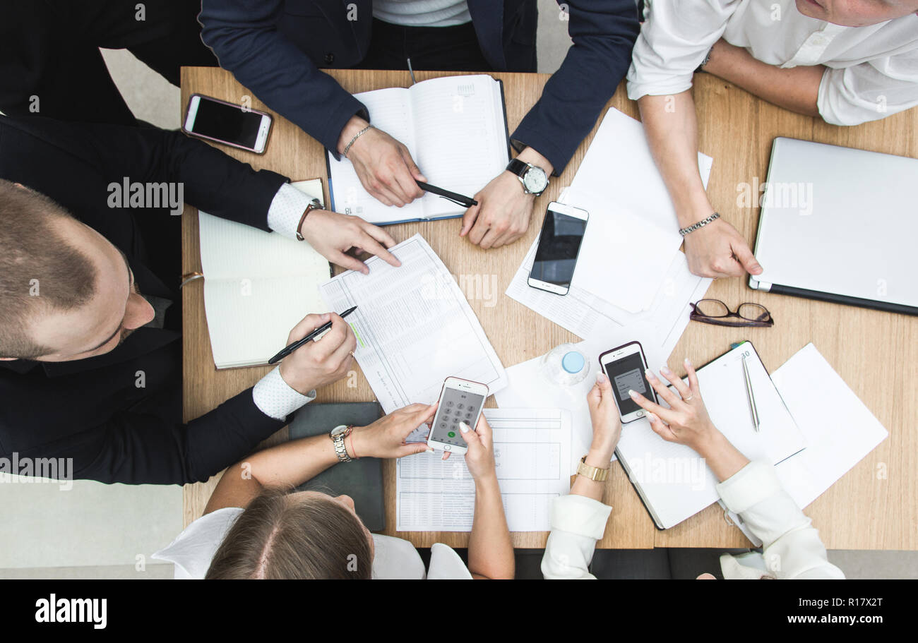 Group of business meeting at the table in the modern office of an ...