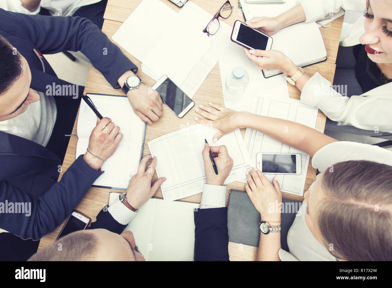 Group of business meeting at the table in the modern office of an ...