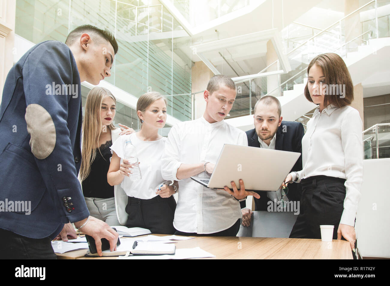 Group of business meeting at the table in the modern office of an ...