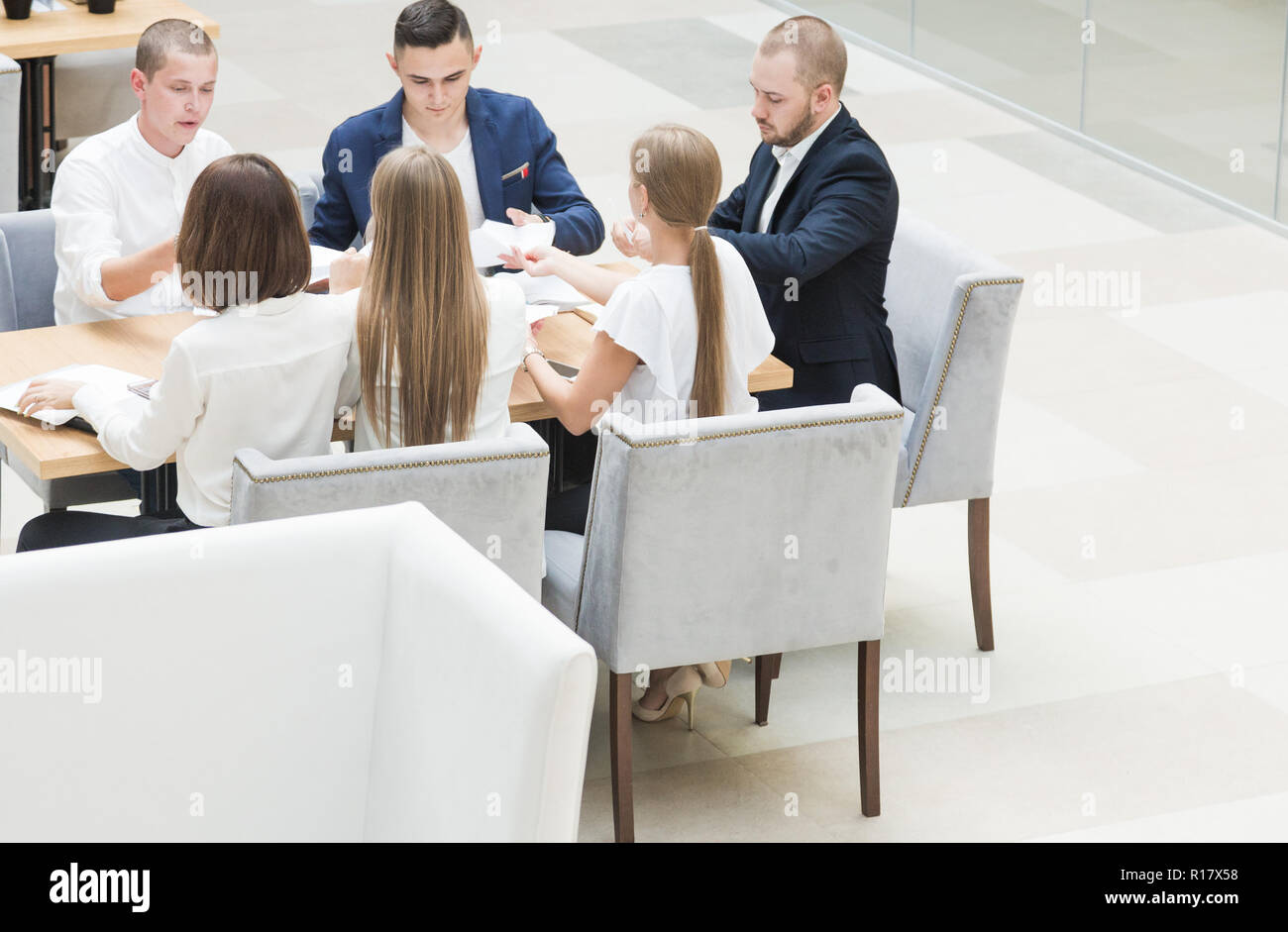 Group of business meeting at the table in the modern office of an ...