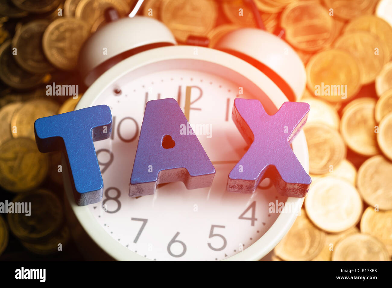 Time to pay TAX concept. TAX alphabet with stack of coin and vintage ...