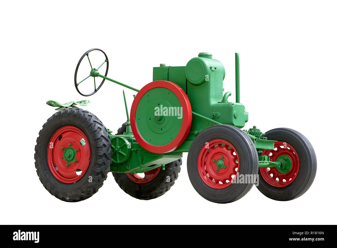 Historically green tractor, isolated on a white background. Retro ...