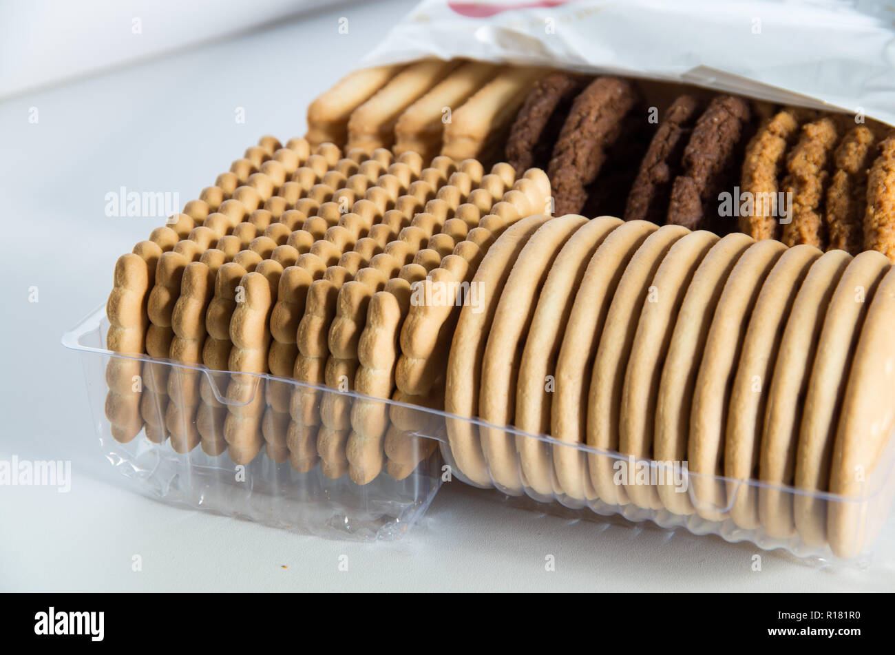 Assorted biscuits in a packaging tray with a white background Stock ...