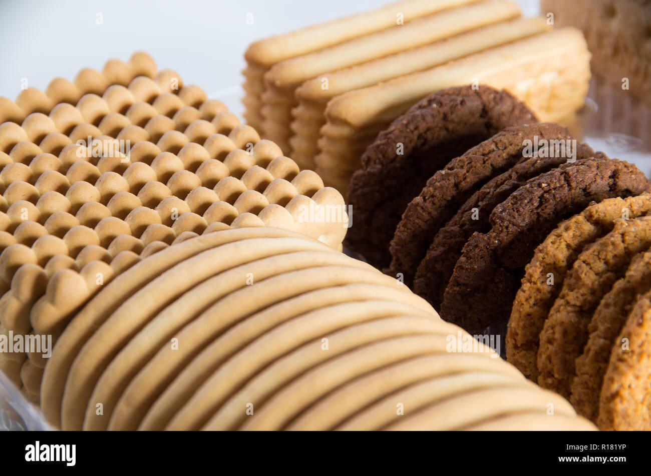 Assorted biscuits in a packaging tray with a white background Stock ...