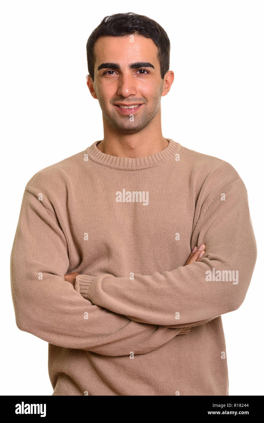 Portrait of young handsome Persian man smiling with arms crossed Stock ...