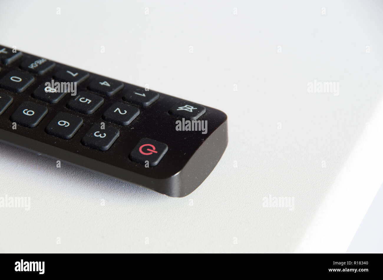 TV Remote on a white background with the power button in focus Stock ...