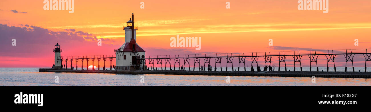 On the Summer Solstice, the sun sets on Lake Michigan between the Inner ...
