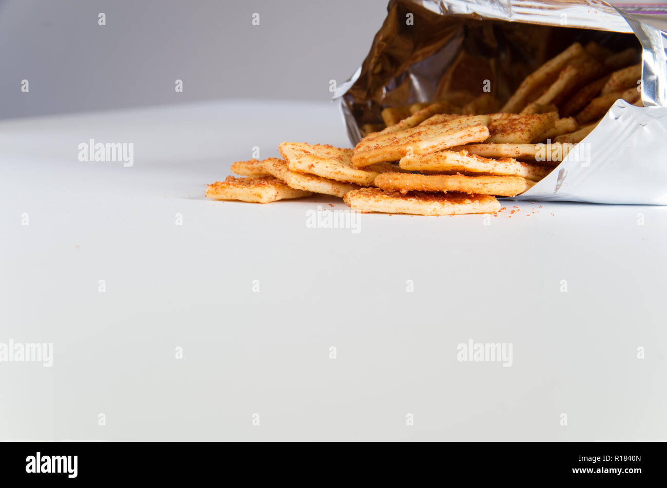Australian Flavoured biscuits spilling out of the packaging onto a ...