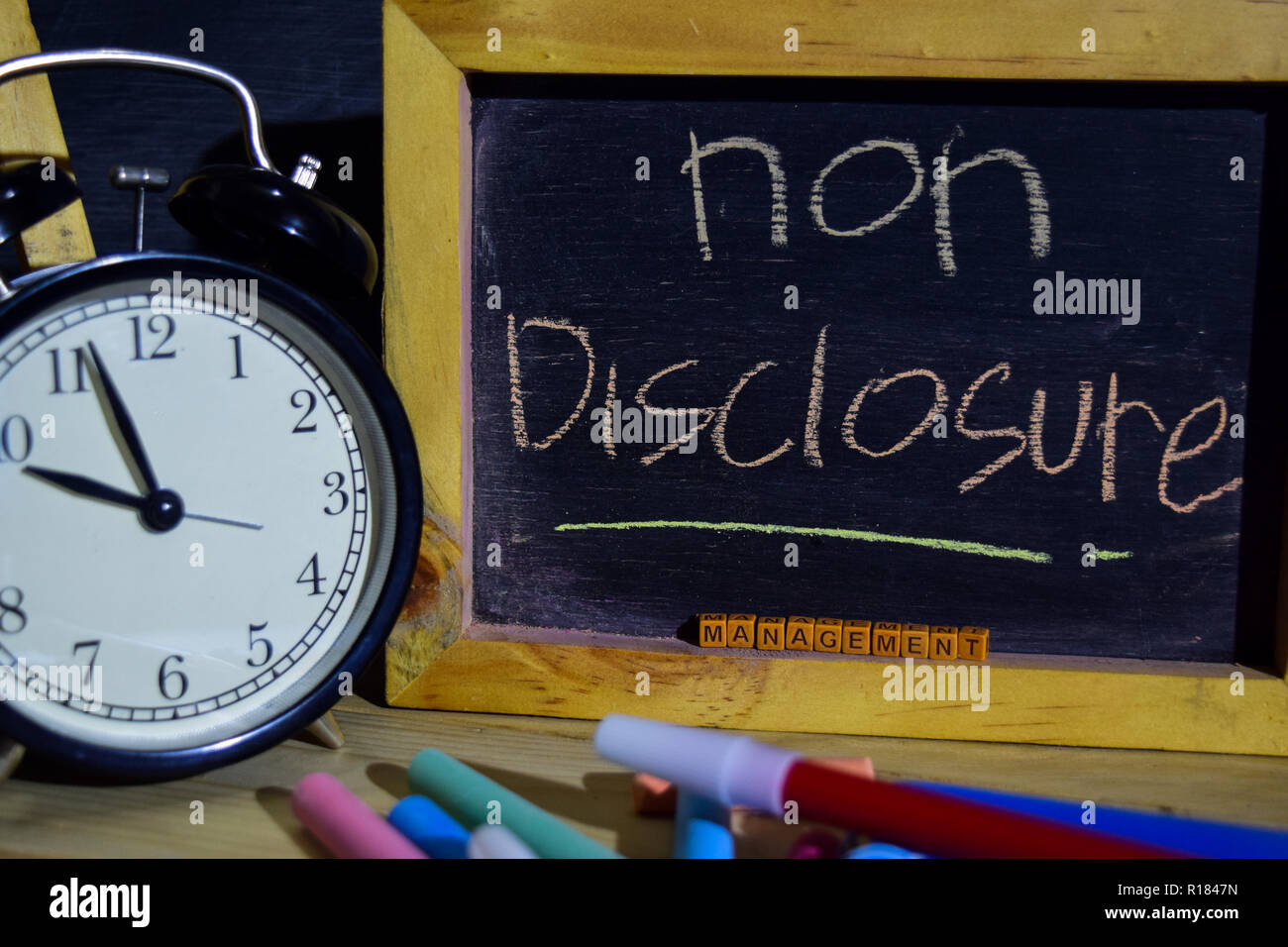 Non disclosure management on phrase colorful handwritten on blackboard ...