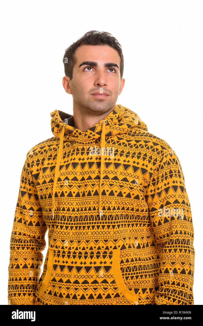 Portrait of young handsome Persian man thinking Stock Photo - Alamy