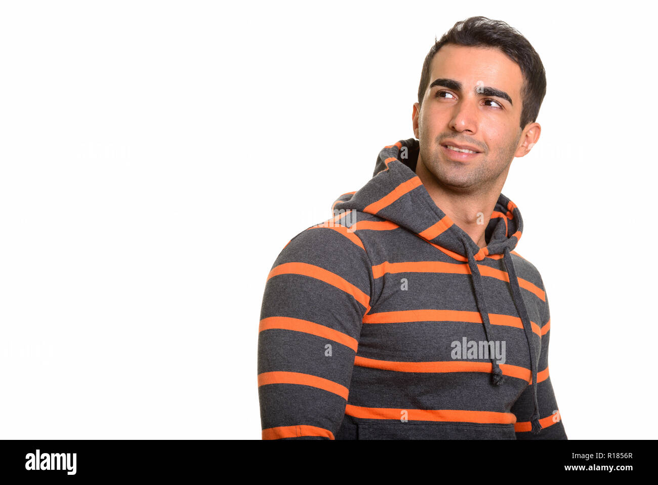 Portrait of young handsome Persian man thinking Stock Photo - Alamy