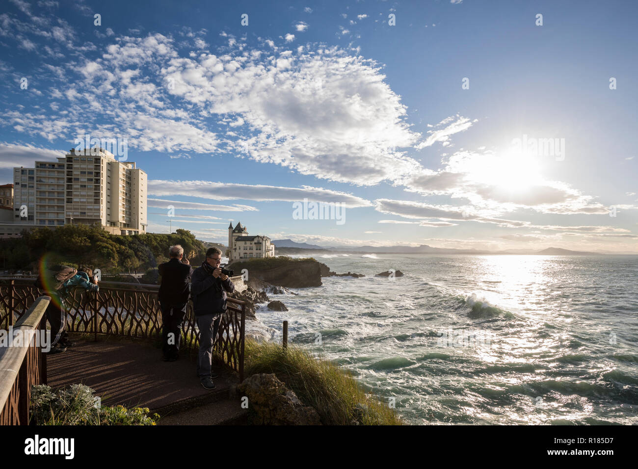 Three people in the same place taking pictures from different angles ...