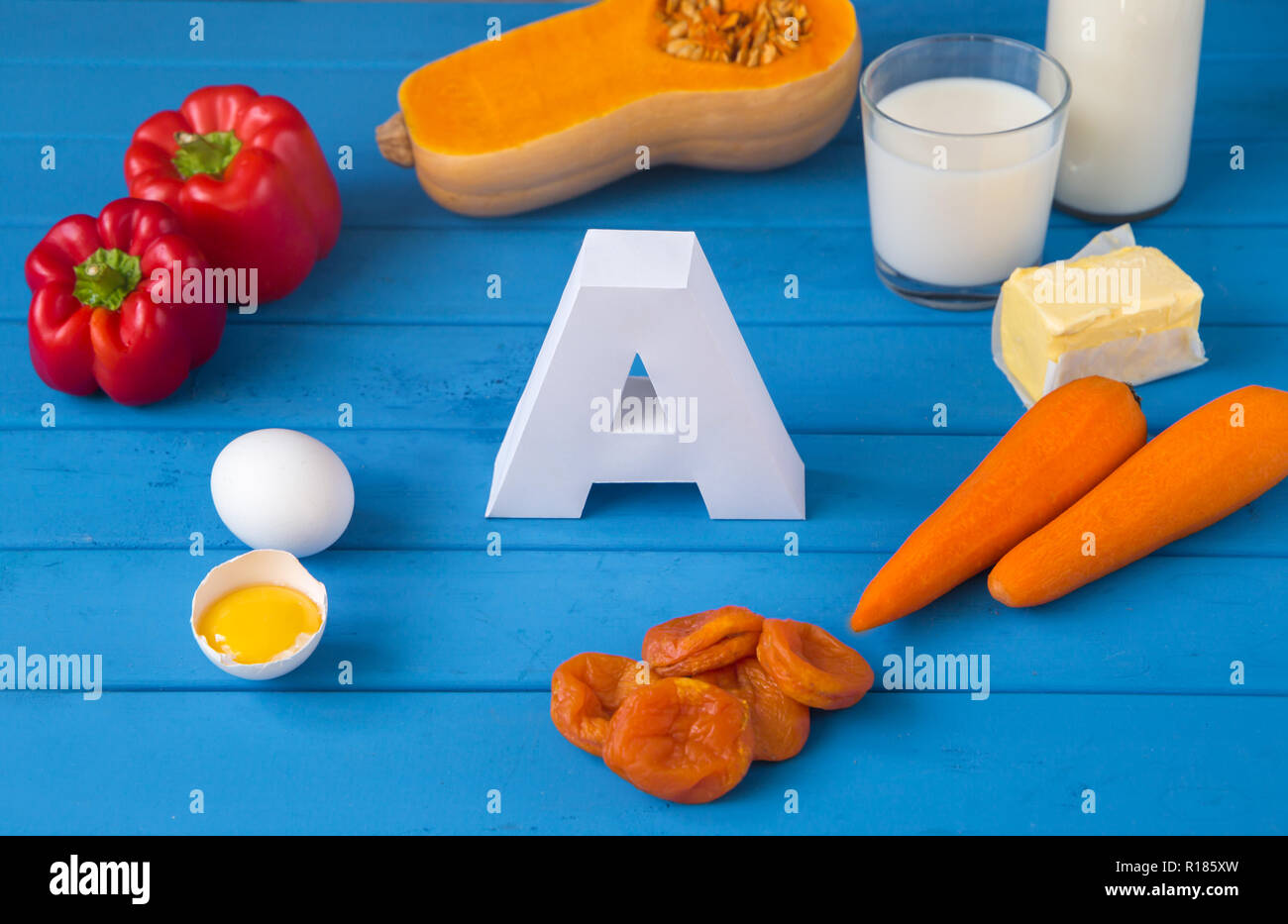 Food sources of natural vitamin A and letter A. Front view. Healthy ...