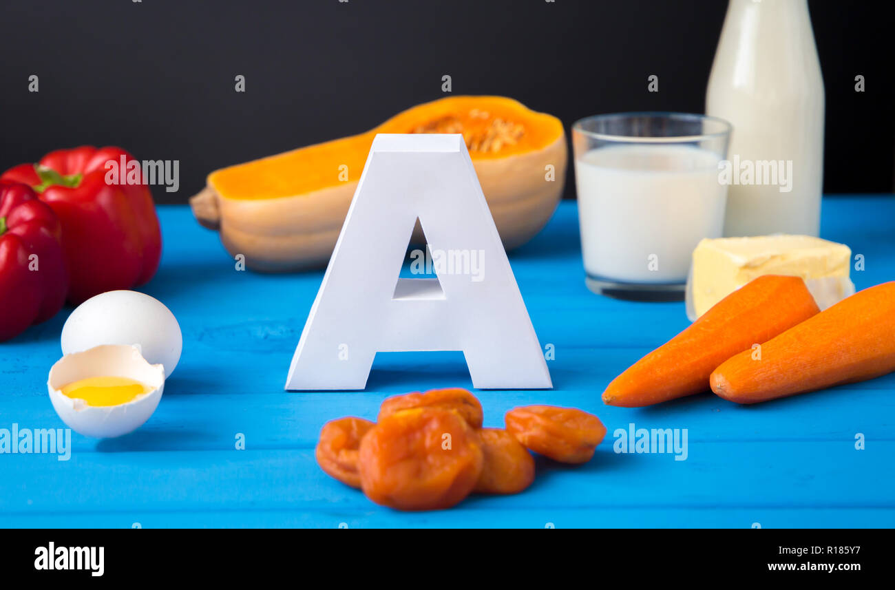 Food sources of natural vitamin A and letter A. Front view. Healthy ...
