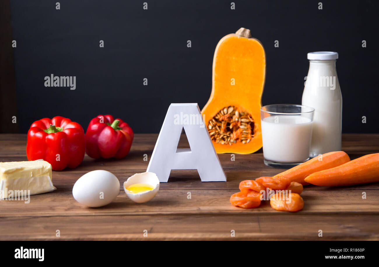 Food sources of natural vitamin A and letter A. Front view. Healthy ...