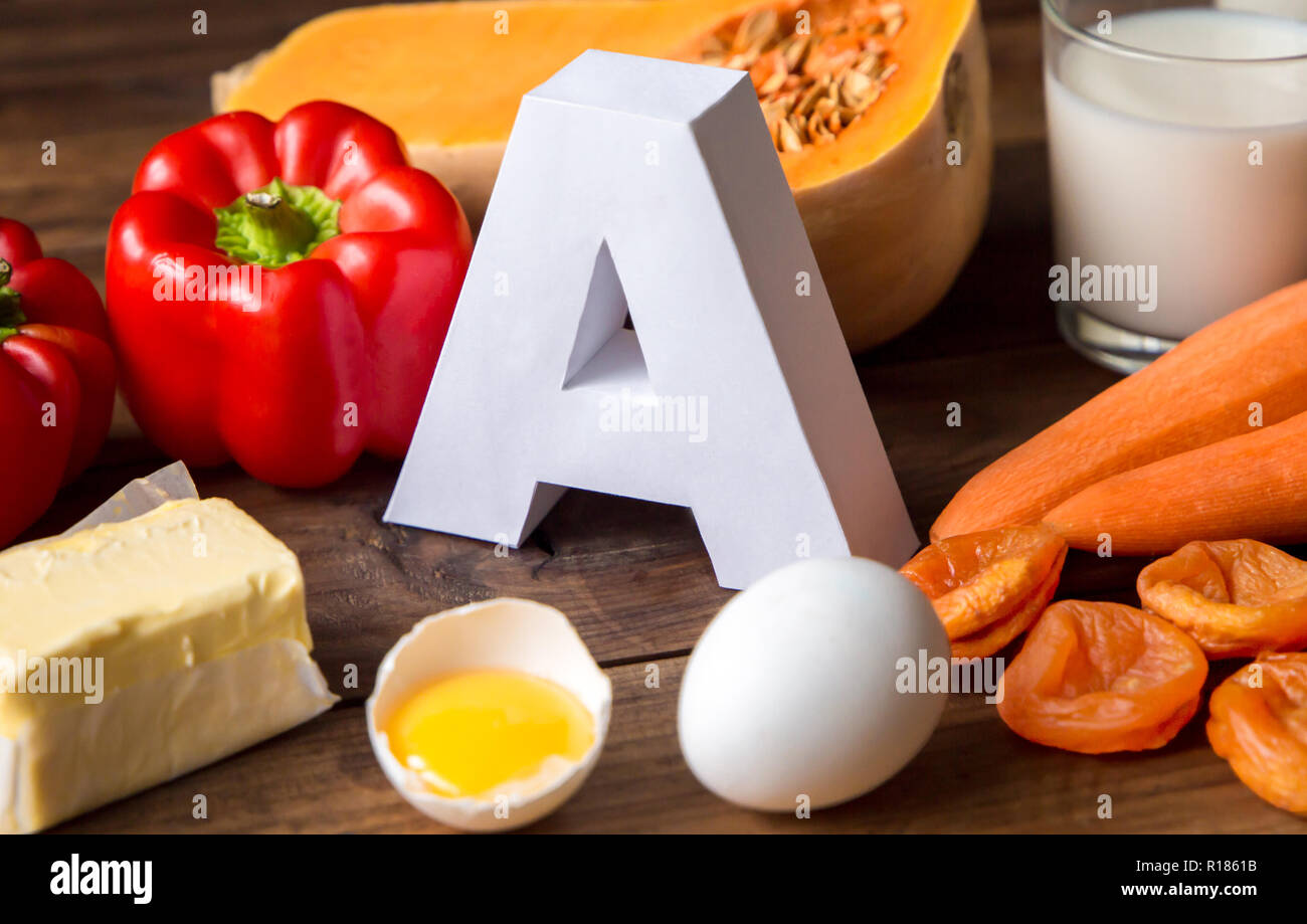 Food sources of natural vitamin A and letter A. Front view. Healthy ...