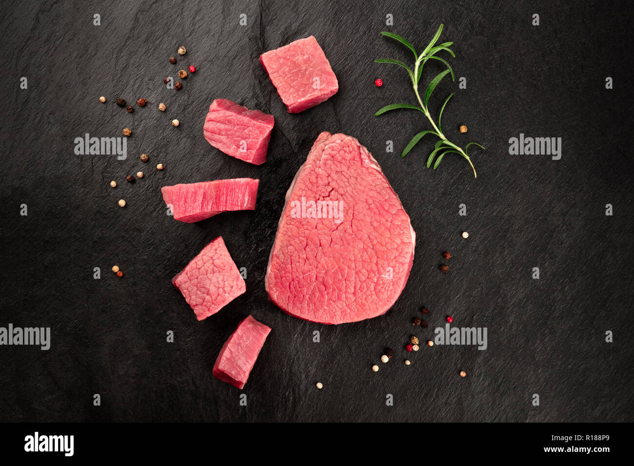 A photo of slices and a steak of eye round beef, a raw cut, with ...